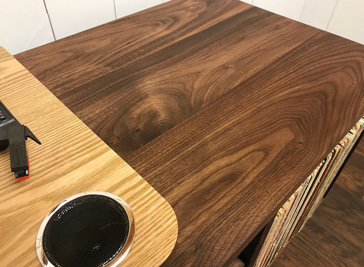 Solid walnut turntable and stereo console with album storage.