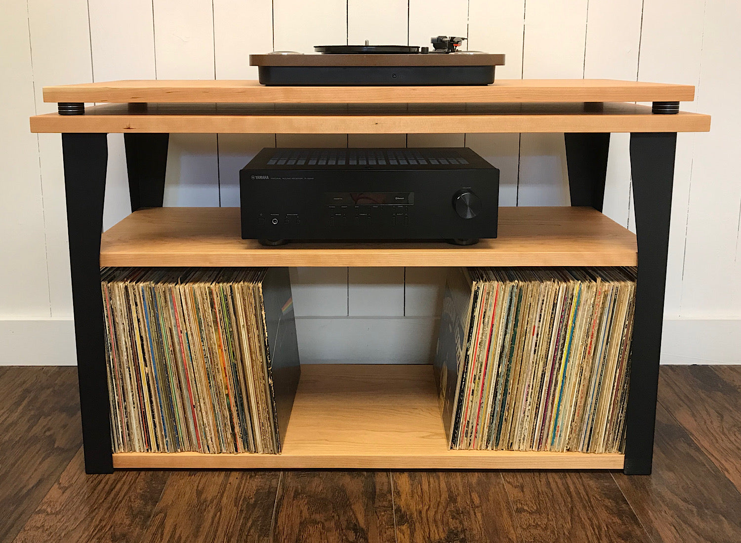 Cherry stereo and turntable console with album storage.