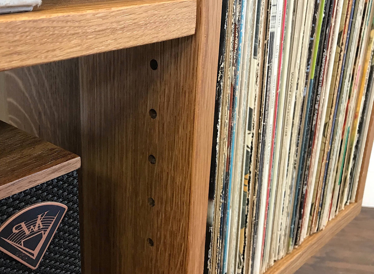 Solid white oak turntable and stereo console with album storage.