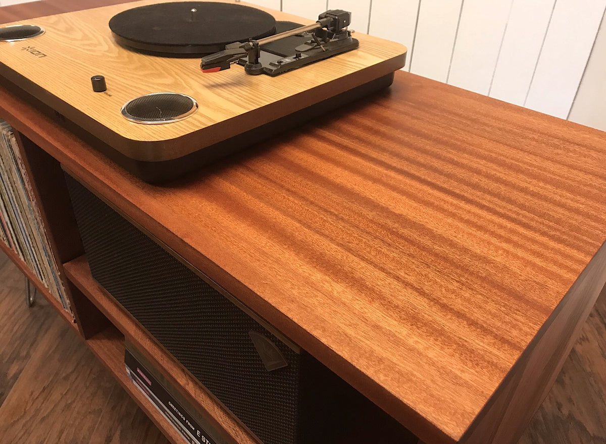 Solid mahogany turntable and stereo console with album storage.