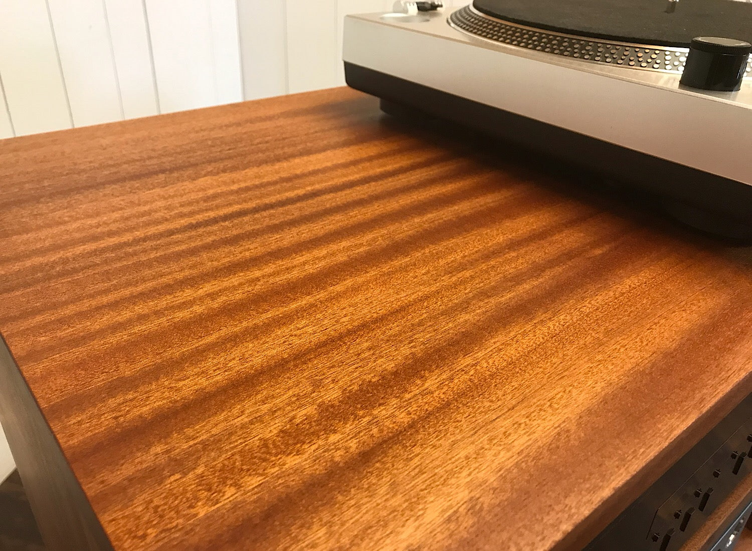 Solid mahogany turntable and stereo console with album storage.